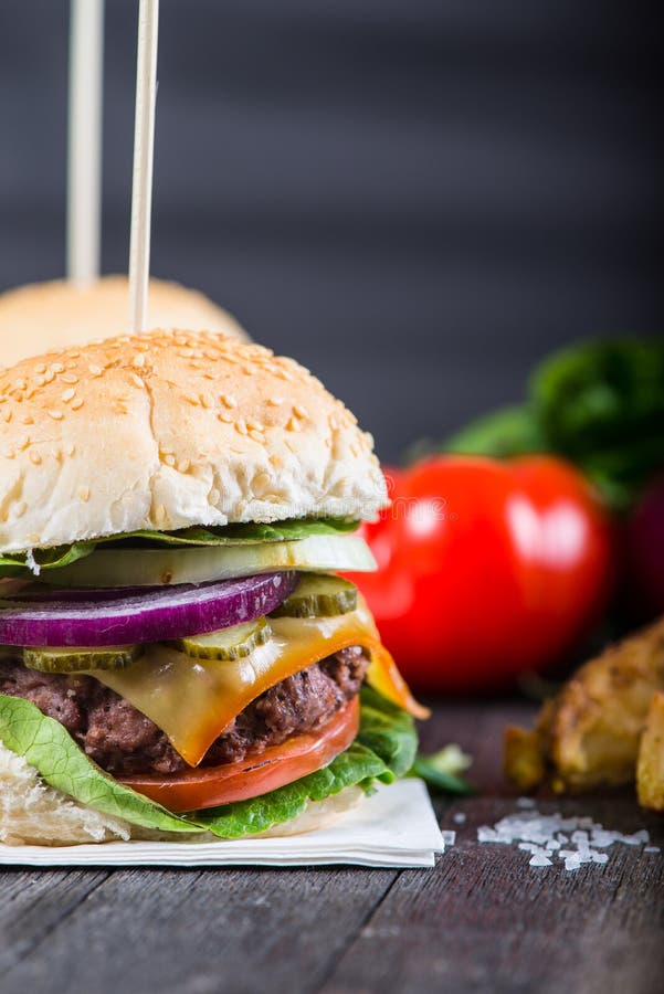 Closeup Pub Style Burger on Wooden Table Stock Image - Image of meat ...