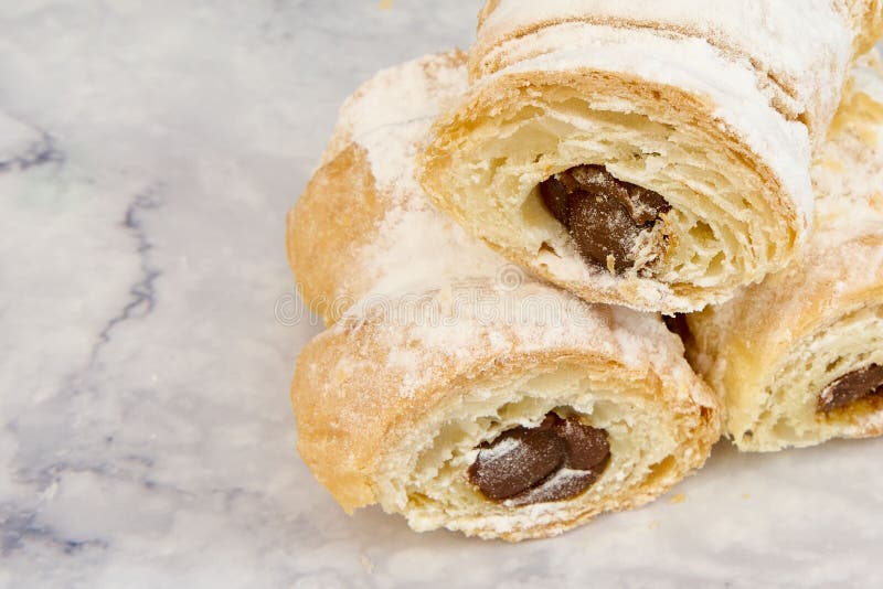 Closeup of Puff Pastry Chocolate Cream Horns with Icing Sugar. Stock ...