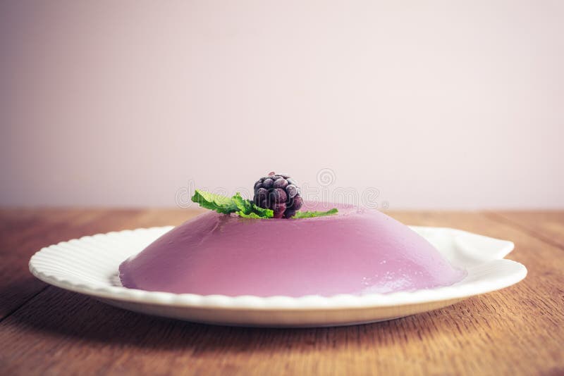 Closeup on a Purple Pudding with a Blackberry Stock Photo - Image of ...