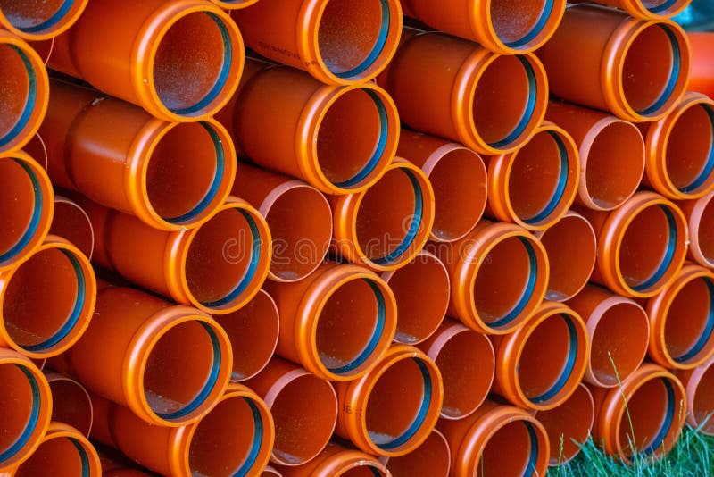 Closeup of Pvc Pipes on a Stack on Green Grass Stock Image - Image of ...