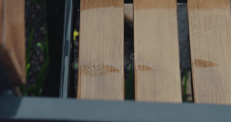 Closeup of Raindrops Falling on a Bench Seat Stock Video - Video of ...