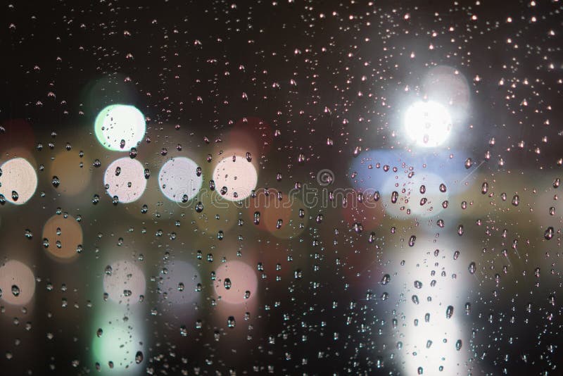 Closeup of Raindrops on Window in Night with Lights Stock Image - Image ...