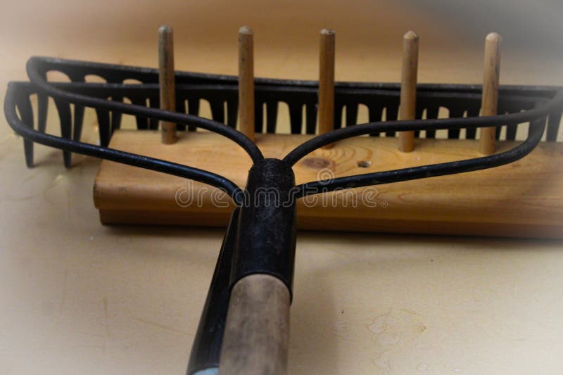 Closeup of Rakes Hanging from a Rack Background Stock Image - Image of ...