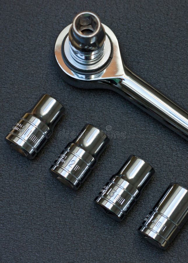 A Closeup of a Ratcheting Socket Wrench with Four Sockets Stock Image ...
