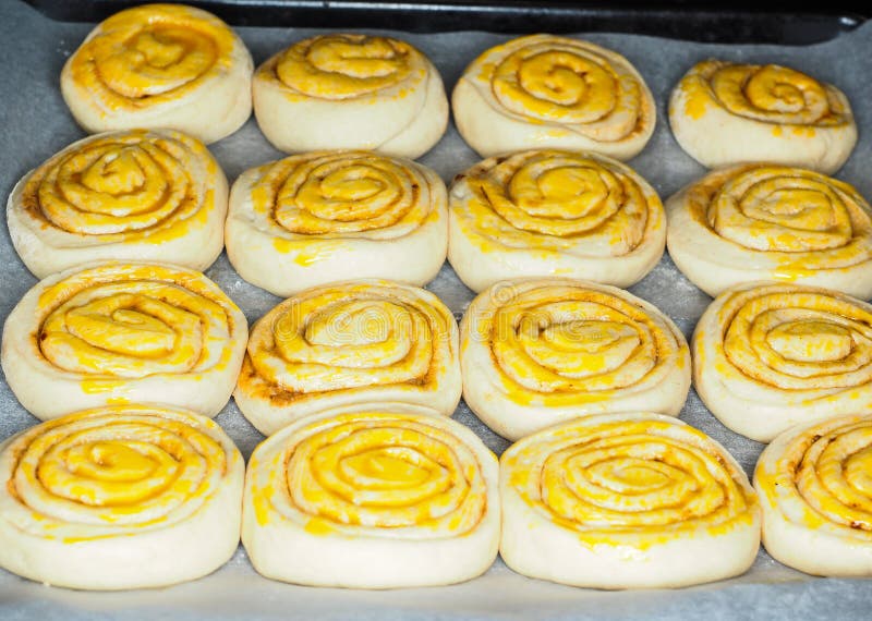 Closeup of Raw Cinnamon Buns after Proofing with Egg Yolk Stock Photo ...