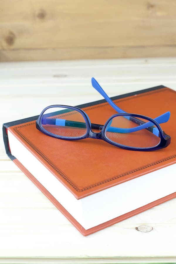 Closeup of Reading Glasses on the Book. Shot in the Library Stock Image ...