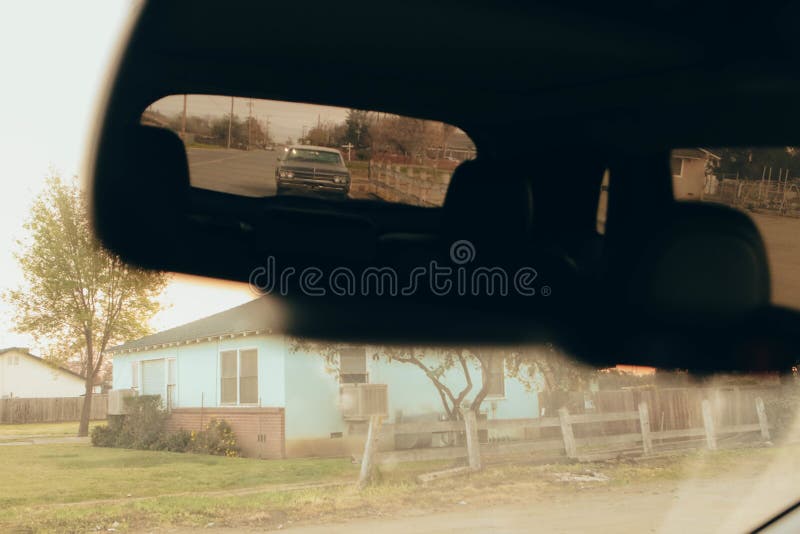 Closeup of the Rearview Mirror with the Reflection of the Road Under ...
