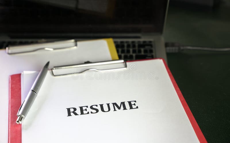 A Resume is on a Table with a Pen and a Laptop Stock Image - Image of ...
