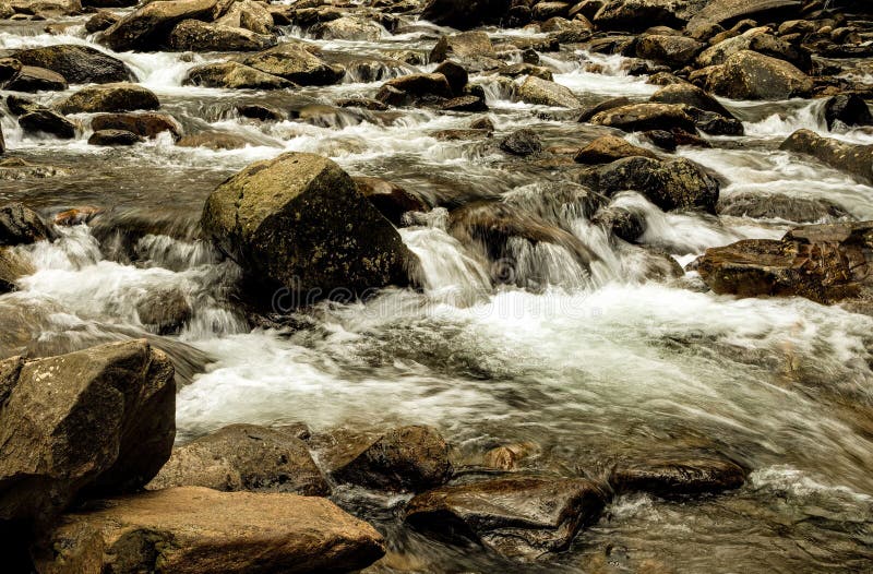 Closeup of a River Flowing through Large Rocks Stock Image - Image of ...