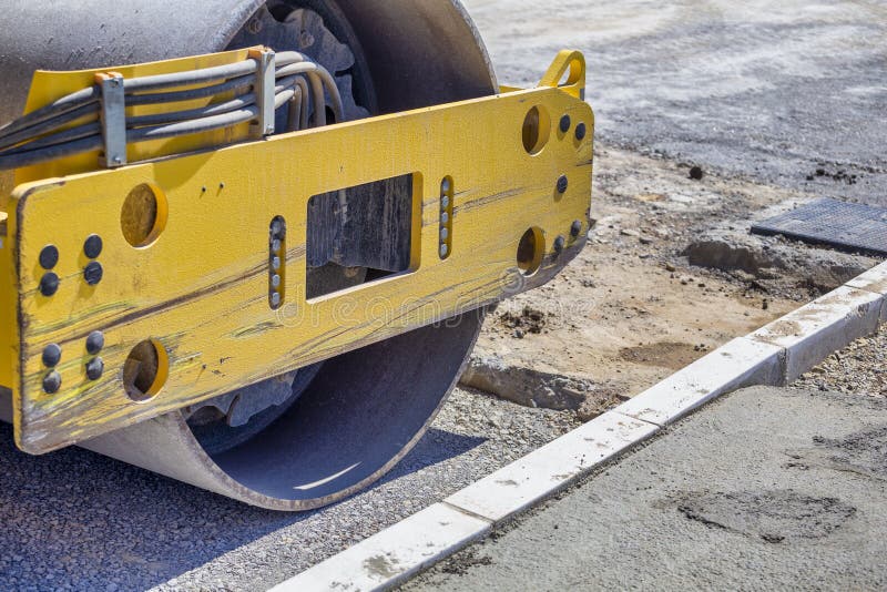 Closeup of Road Roller Working Near the Curb Stock Photo - Image of ...