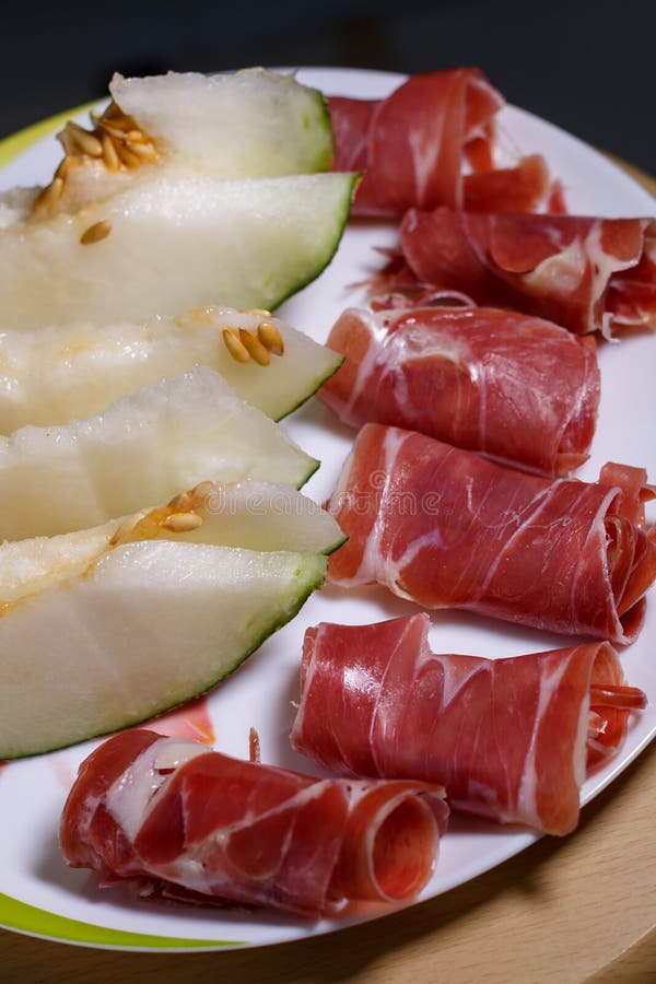 Closeup of Rolled Slices of Cured Pork Ham Jamon with Melon Stock Image ...