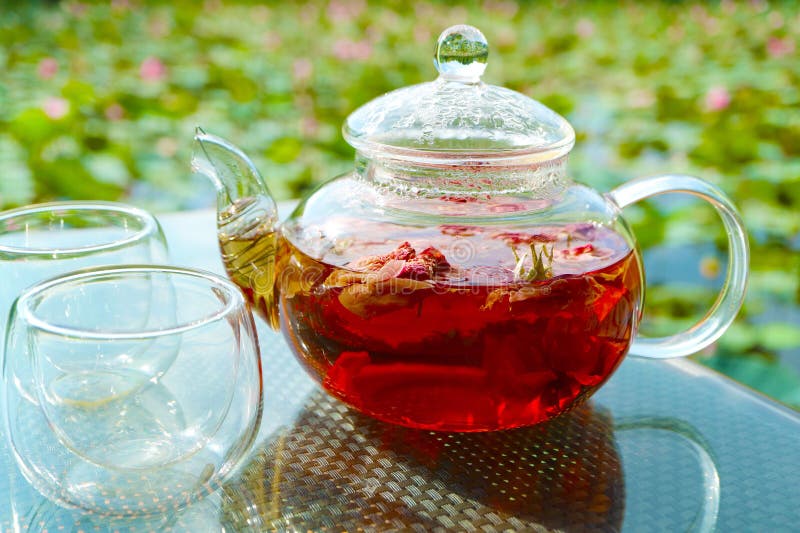 Rose Tea Being Steeped in a Teapot on Garden Table Stock Image - Image ...