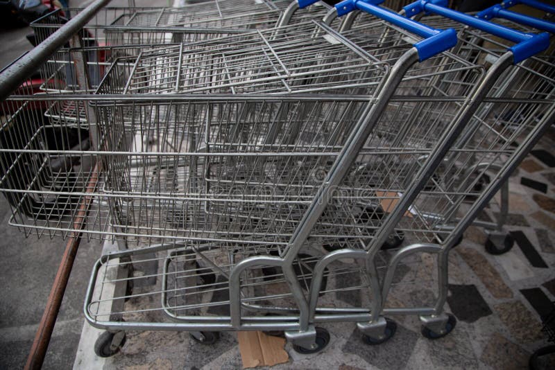 Closeup of a Row of Empty Grocery Trolleys Stock Image - Image of ...