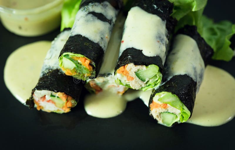 Closeup Salad Roll in Black Dish with Crab Sticks, Cucumbers ...