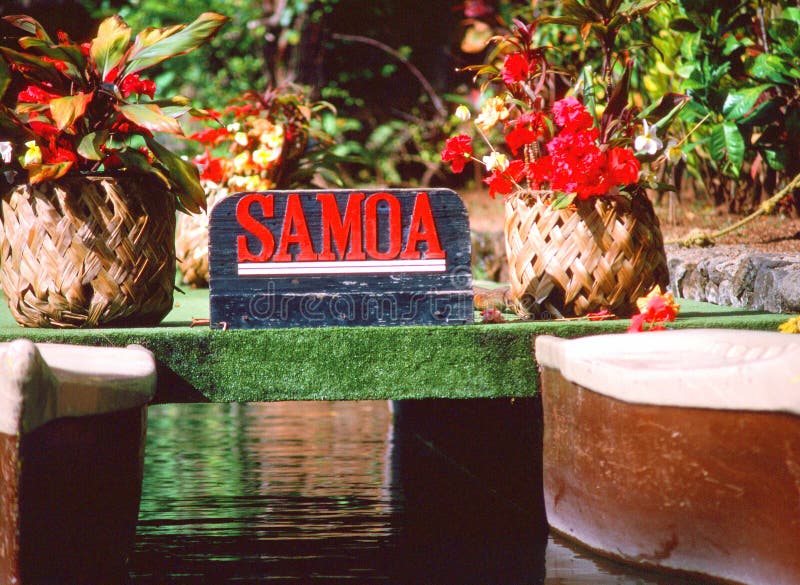 Closeup of a "SAMOA" Island Sign in between Basket of Flowers on the ...