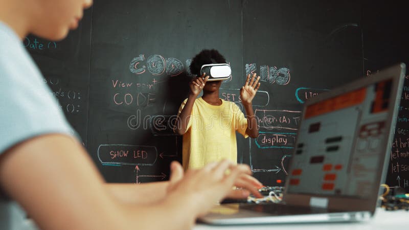 Closeup of School Girl Hand Coding Program while Student Using VR ...