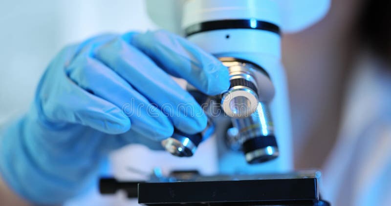 Closeup of Scientist Hand Preparing Microscope for Use Stock Footage ...