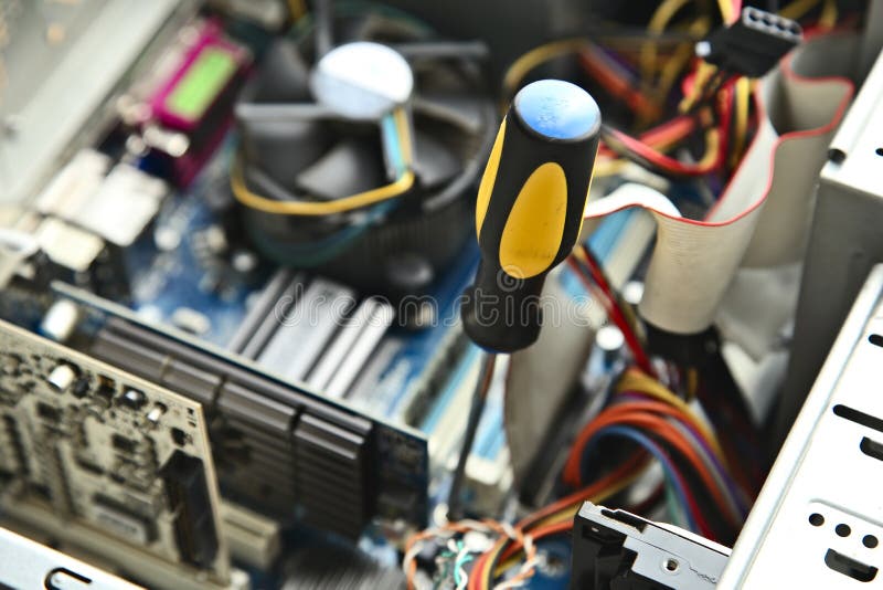Closeup of a Screwdriver on the Computer Components in an Open Case ...