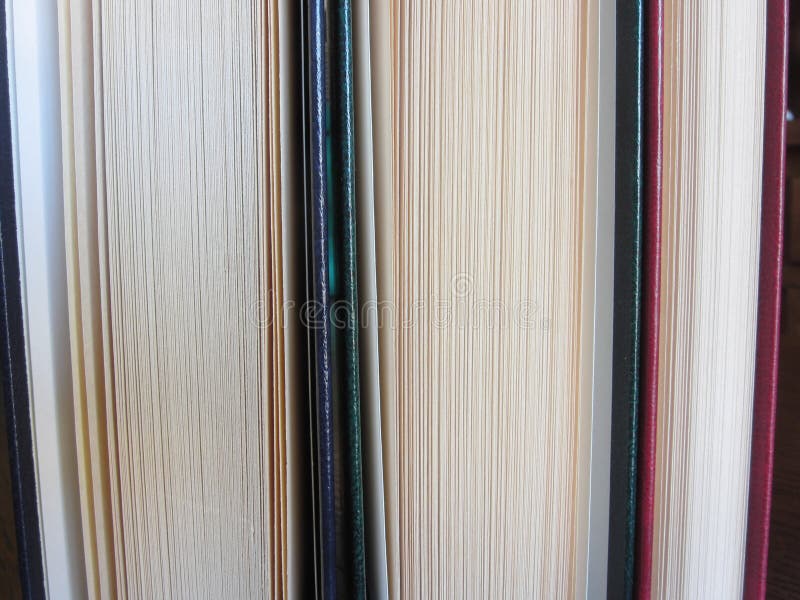Closeup of Second Hand Books Standing on a Wooden Table . Front View ...