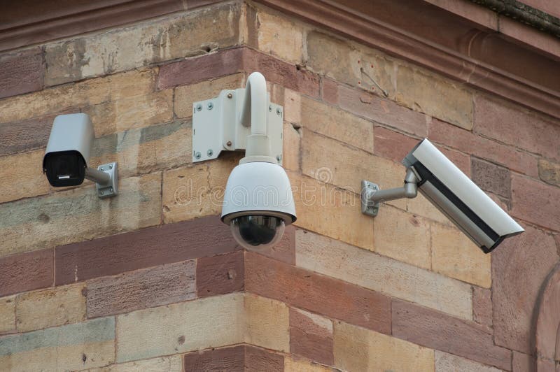 Security Camera in the City on Building Facade Stock Image - Image of ...