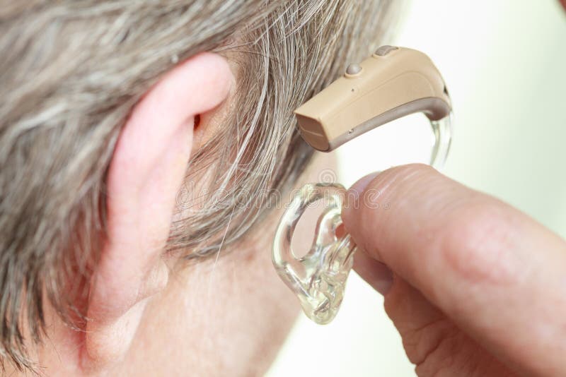 Closeup Senior Woman Using Hearing Aid Stock Photo - Image of aged ... Closeup Senior Woman Using Hearing Aid Stock Photo - Image of aged ...
