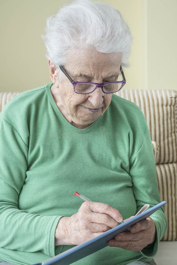 Closeup of an Old Woman Writing Something Stock Image - Image of aged ...