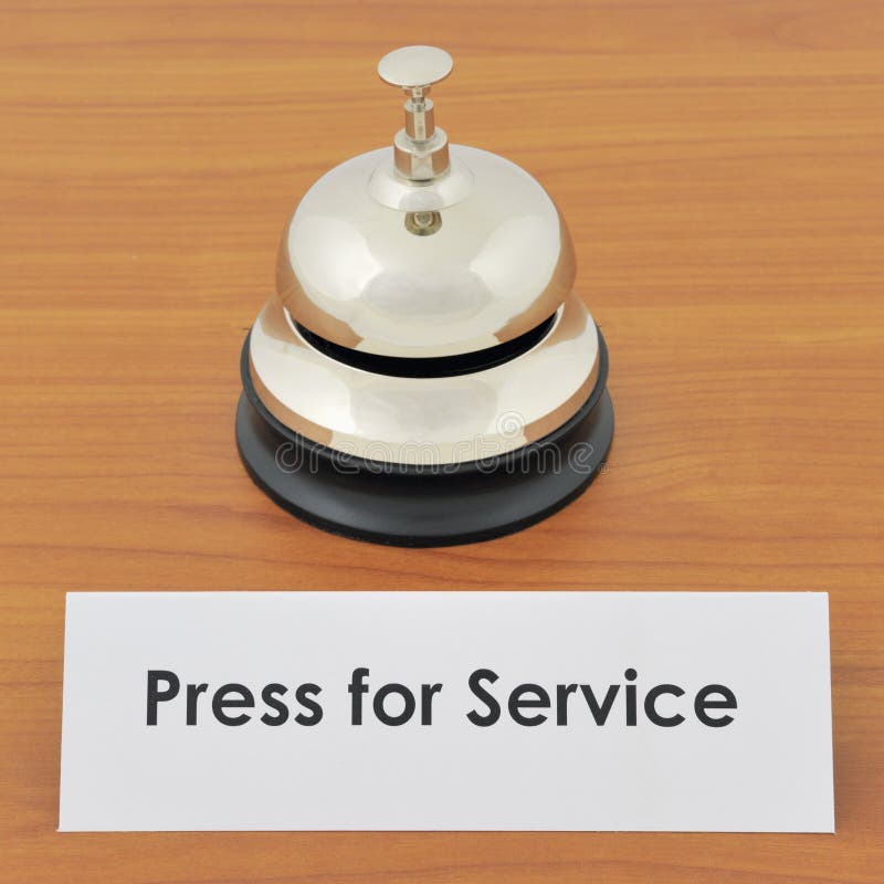 Closeup of Service Bell and Sign on Wooden Desk Stock Image - Image of ...