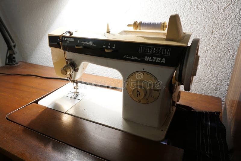 Closeup of Sewing Machine on Wood Surface Editorial Photography - Image ...