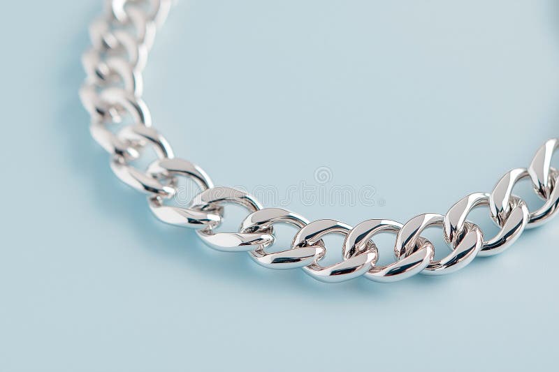 Closeup of a Shining Silver Chain on a Textured Light Background ...