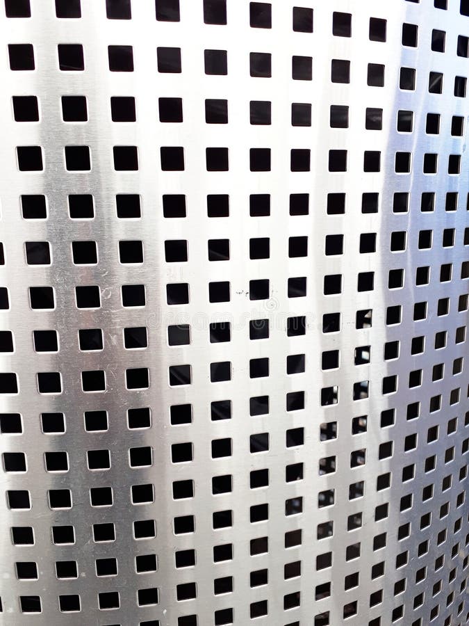 Closeup of Shiny, Silver Colored Metal with Many Square Holes in it ...