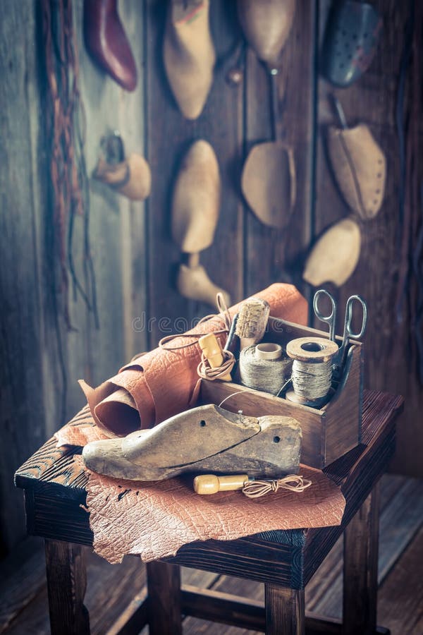 Closeup of Shoemaker Workshop with Shoes, Laces and Tools Stock Photo ...