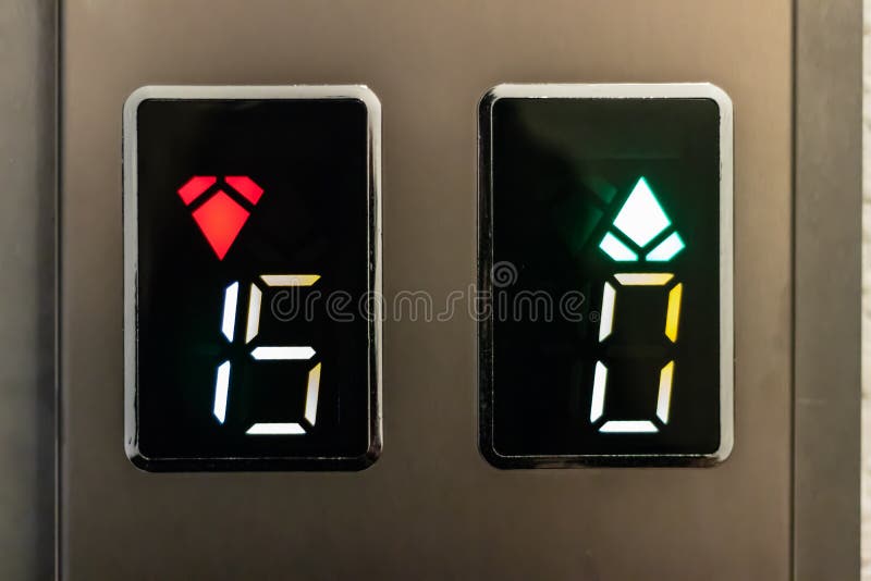 A Closeup Shoot of Elevator Signs with Up and Down Arrows and Numbers ...