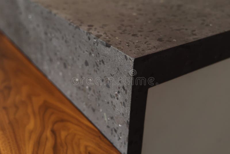 Closeup Shot of Adjoining between Walnut Table and Concrete Countertop ...