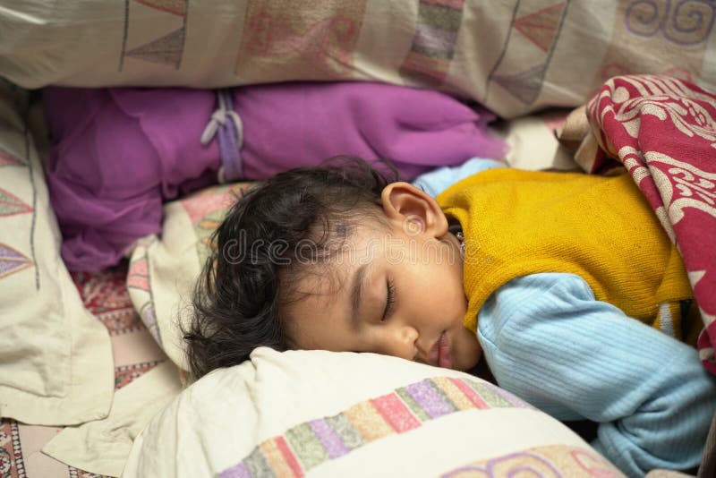 Closeup Shot of an Adorable Baby Sleeping in Bed Stock Photo - Image of ...