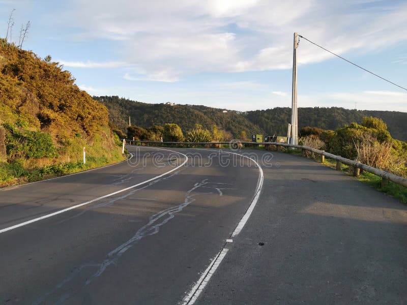 Closeup Shot of a Asphalt Road Curve with Greenery on the Side Stock ...
