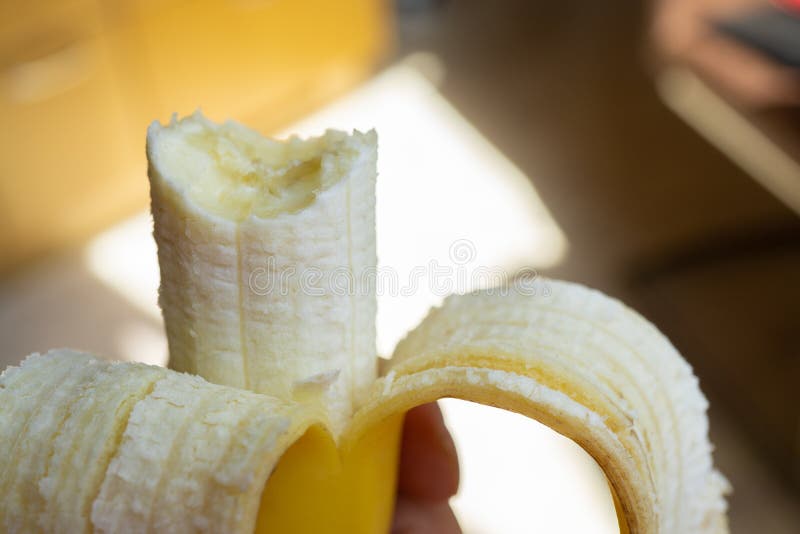 Closeup Shot of a Bitten Banana Stock Image - Image of snack, bitten ...