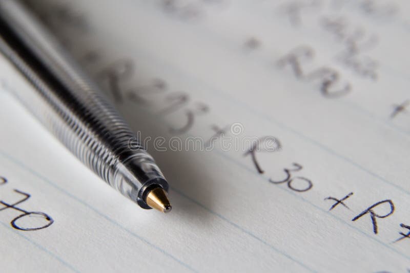 Closeup Shot of a Black Pen on a Piece of Paper with Some Numbers and ...