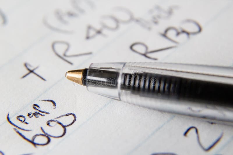 Closeup Shot of a Black Pen on a Piece of Paper with Some Numbers and ...