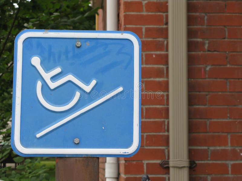 Closeup Shot of a Blue Signpost about Disableds Stock Image - Image of ...