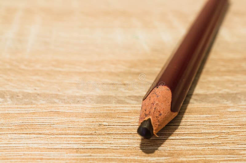 Closeup Shot of a Brown Pencil on a Wooden Surface Stock Image - Image ...