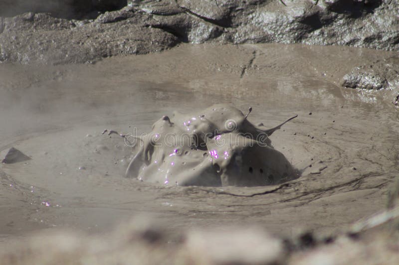 Bubbling mud pool stock photo. Image of yellow, stone - 73699450