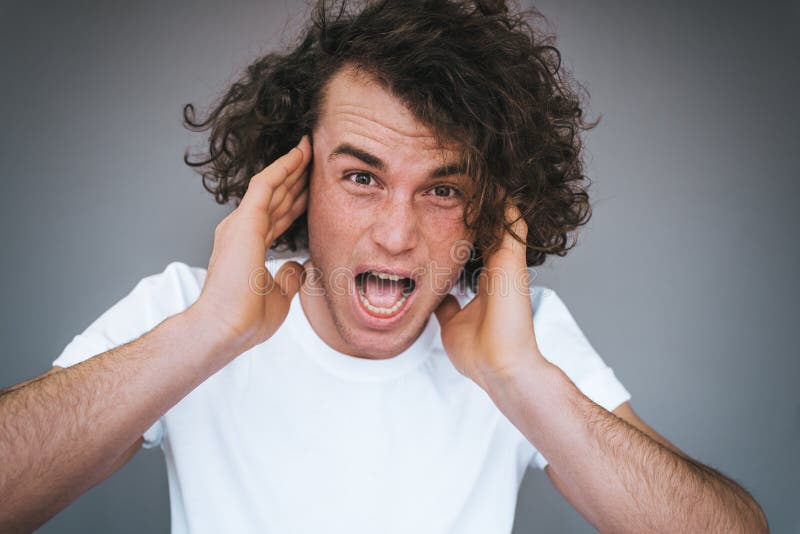Portrait Of Handsome Curly Hair Male Shows Refusal And Stop Gesture