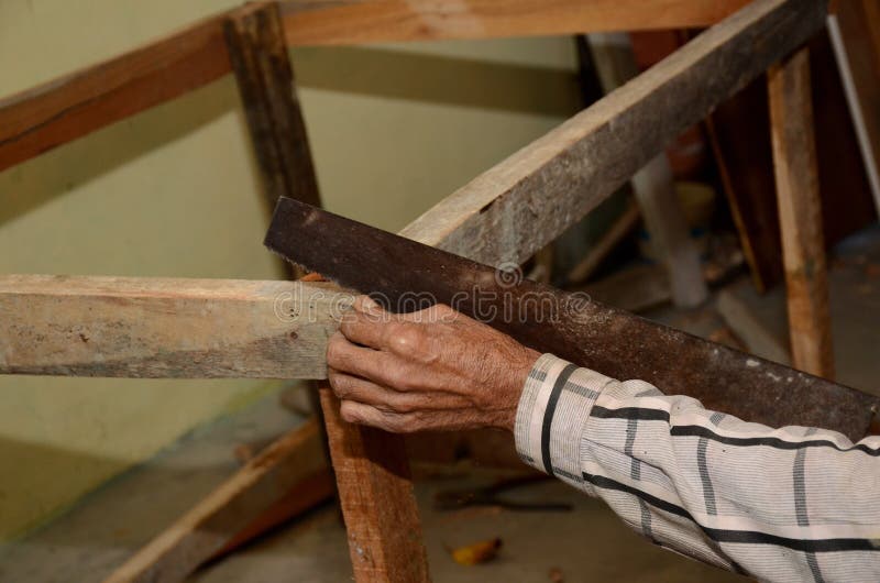 Closeup Shot of a Carpenter Cutting Timber Materials with a Saw Stock ...