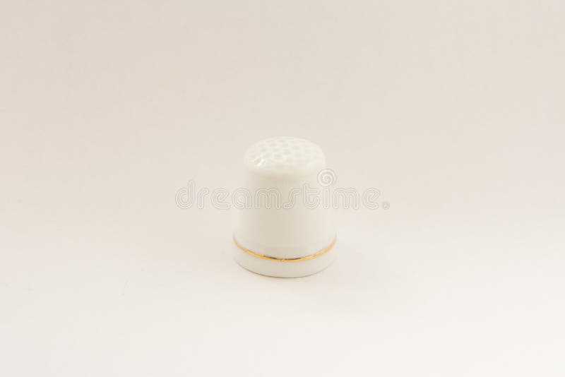 Closeup Shot of a Ceramic Thimble on a White Background Stock Photo ...