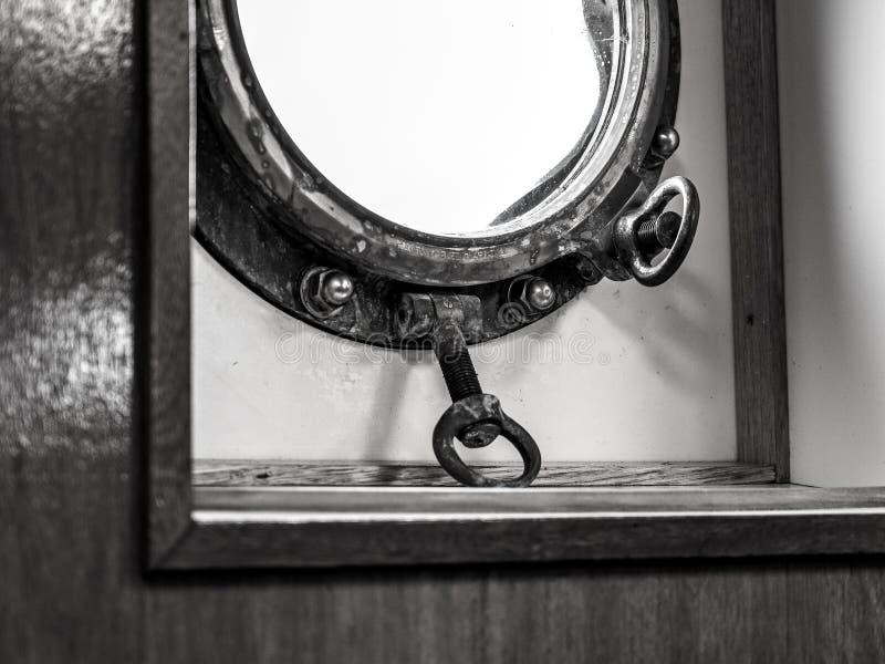 Closeup Shot of a Circular Window of a Ship with Thick Metal Frames ...