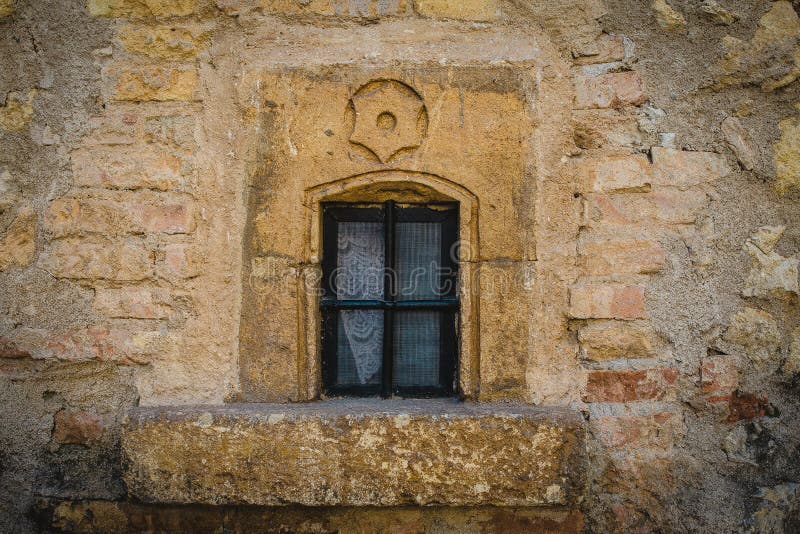 Closeup Shot of a Closed Window on a Yellow Stone Wall Stock Photo ...