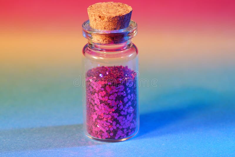 Closeup Shot of Colored Glitter in a Tiny Glass Container Stock Image ...