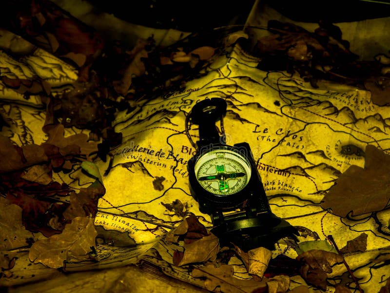 Closeup Shot of a Compass and Autumn Leaves on a Map Stock Photo ...