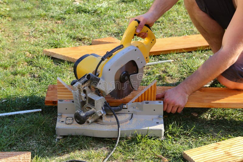 Closeup Shot of a Construction Worker Chopping Wood with a Saw Stock ...