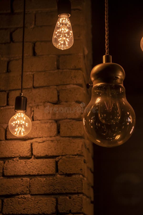 Closeup Shot of Cool Bulbs with a White Brick Wall on the Background ...